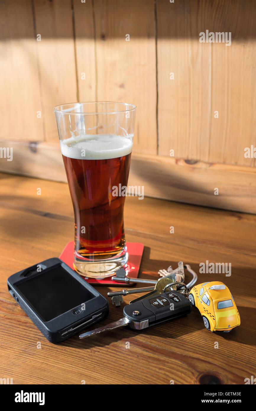 Car keys with a pint of beer and a mobile phone Stock Photo - Alamy