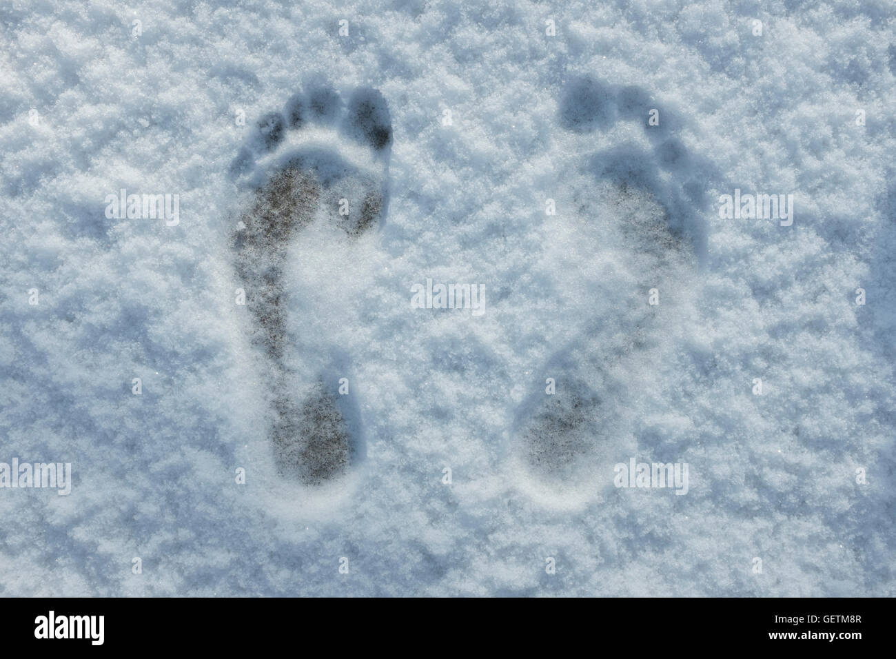 Human footprints in the snow Stock Photo - Alamy