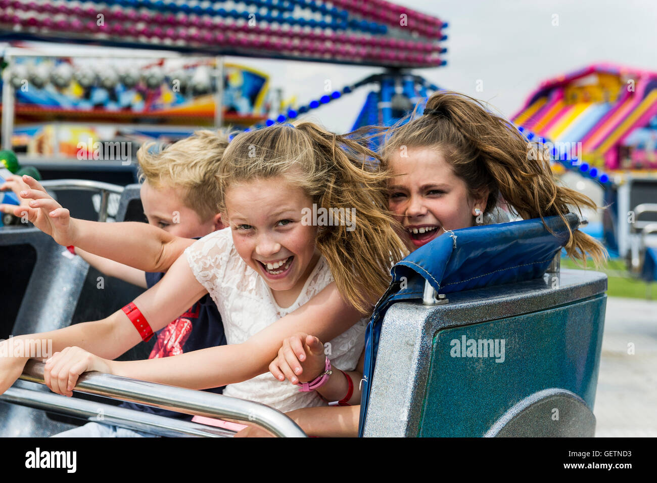 Children enjoying themselves on a fairground ride at the Brentwood ...