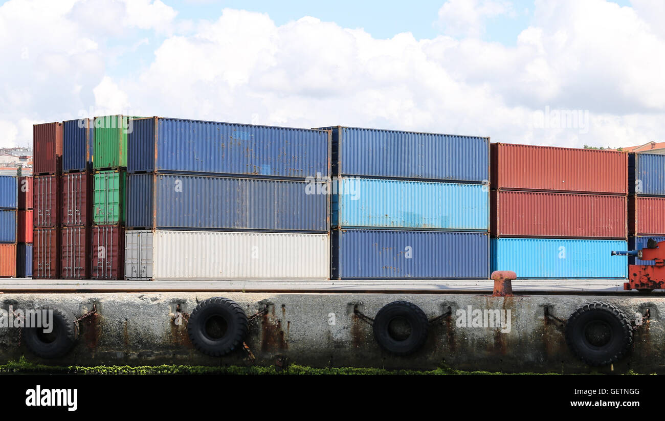 Containers waiting to transfer in a port Stock Photo - Alamy