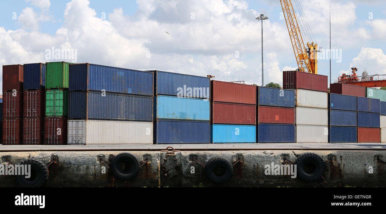 Containers waiting to transfer in a port Stock Photo - Alamy