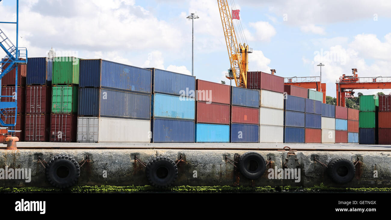 Containers waiting to transfer in a port Stock Photo - Alamy