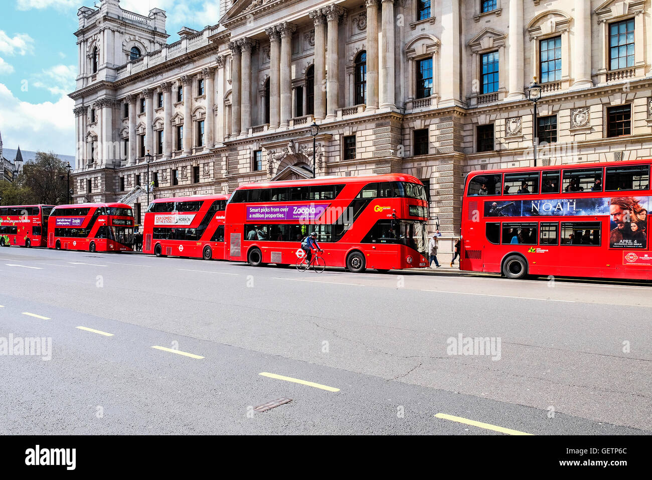 Five London buses queueing at a bus stop Stock Photo - Alamy