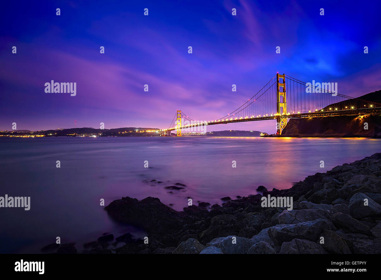 The Golden Gate Bridge illuminated at night from Fort Baxter Stock ...