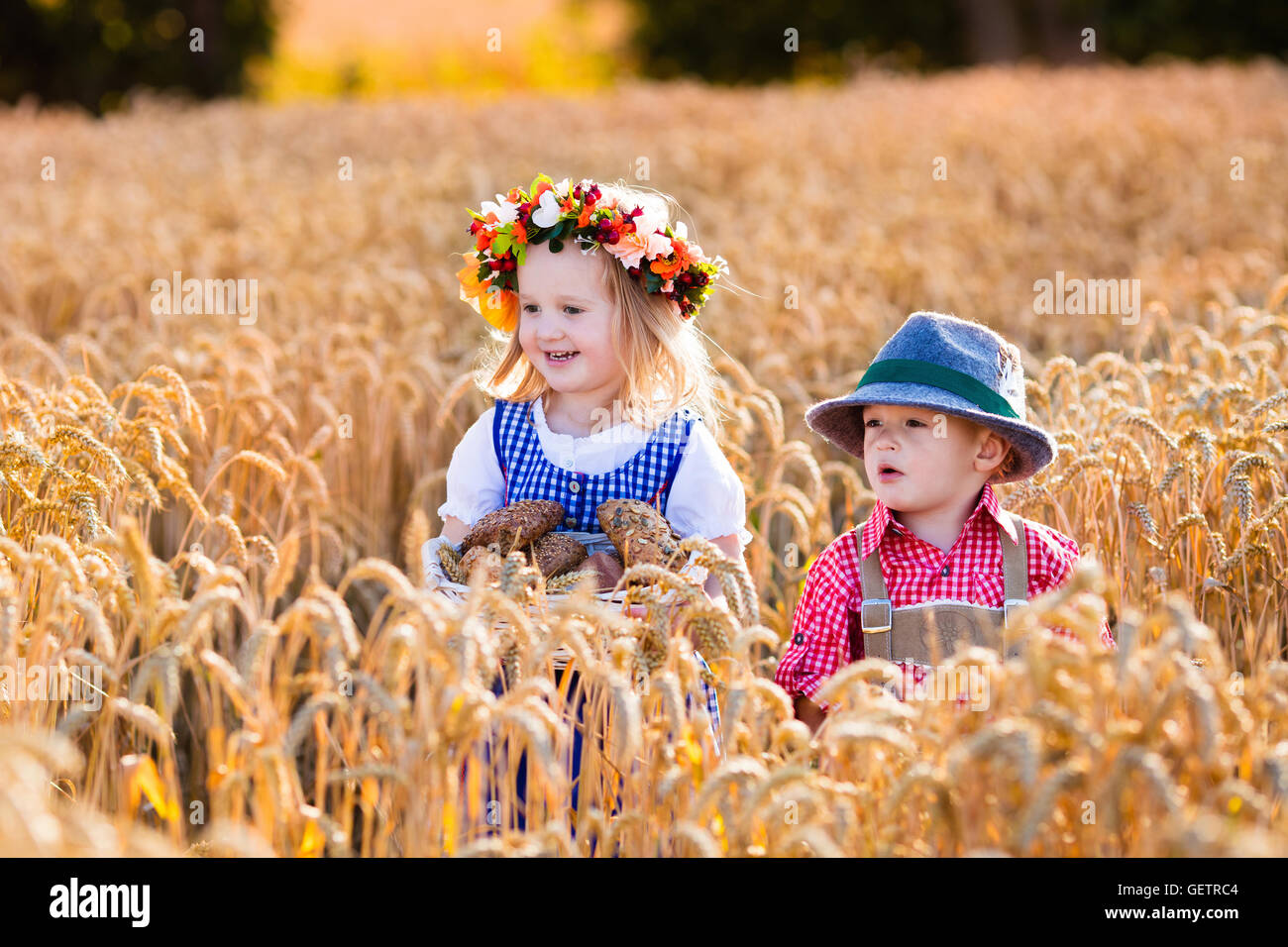 Kids in traditional Bavarian costumes in wheat field. German children ...