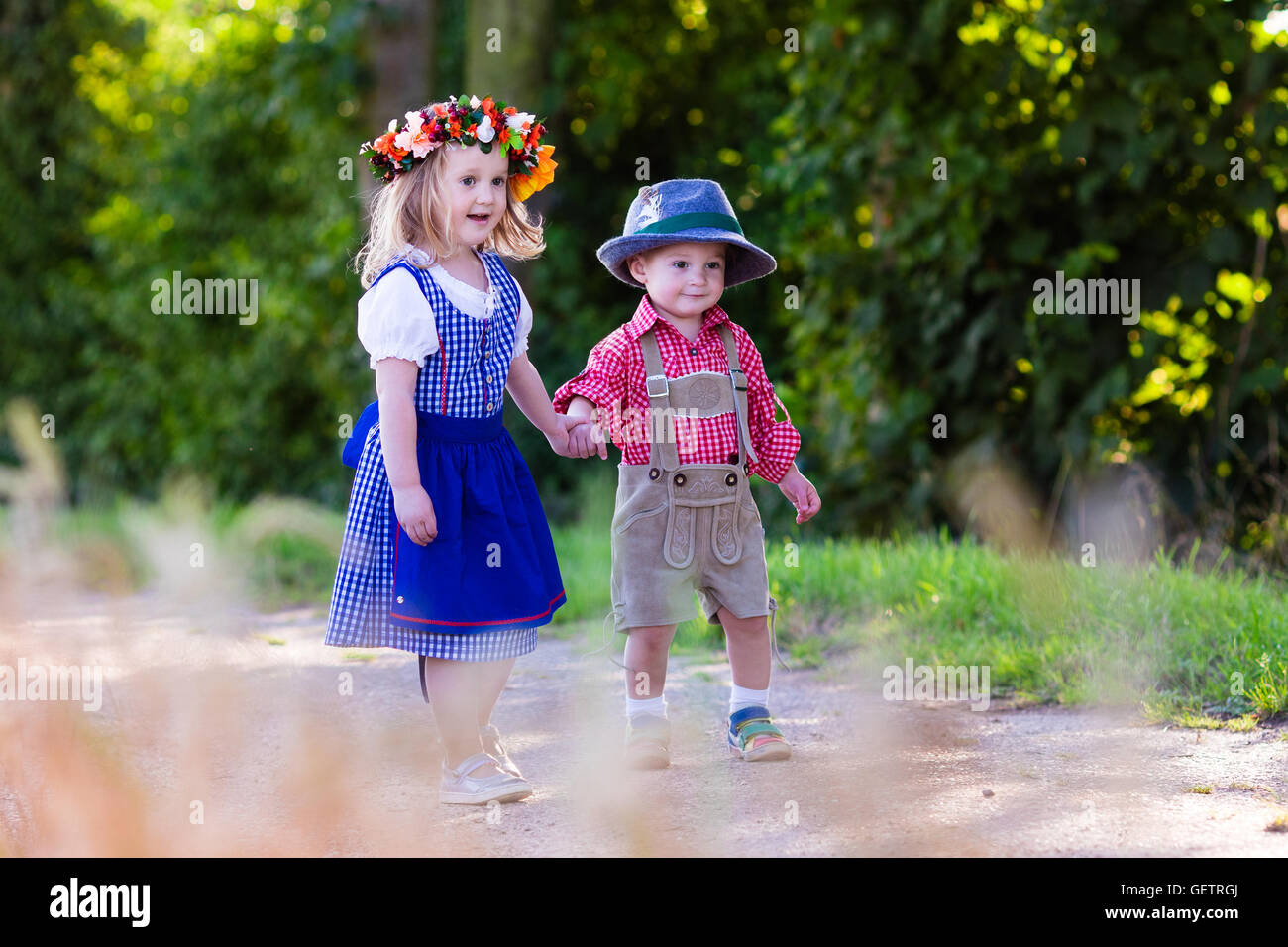 Kids in traditional Bavarian costumes in wheat field. German children ...