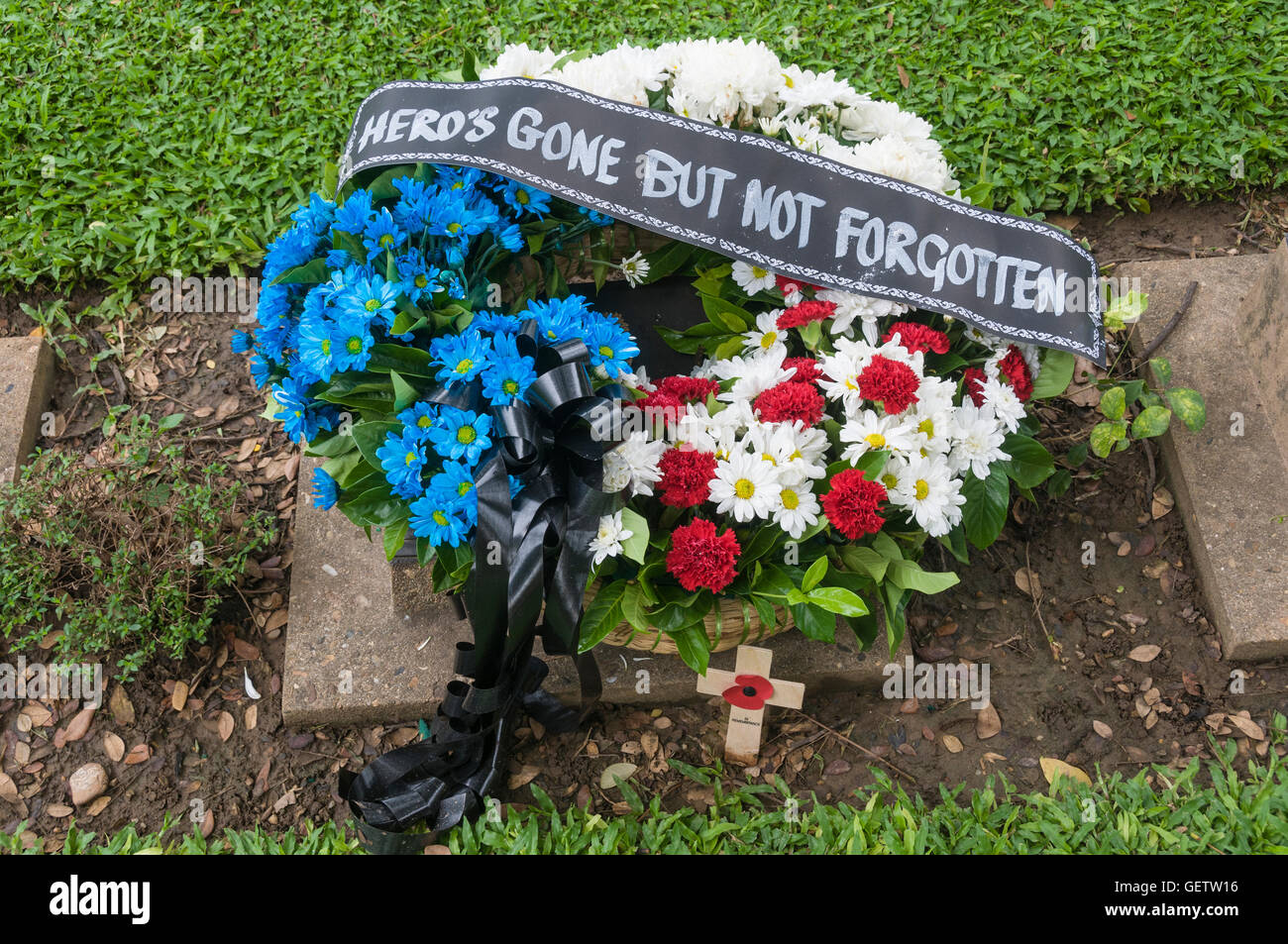 A memorial to a British soldier at the main POW cemetery associated ...