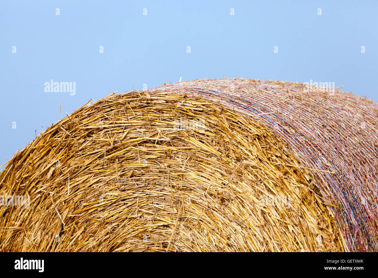 stack of straw in the field Stock Photo - Alamy