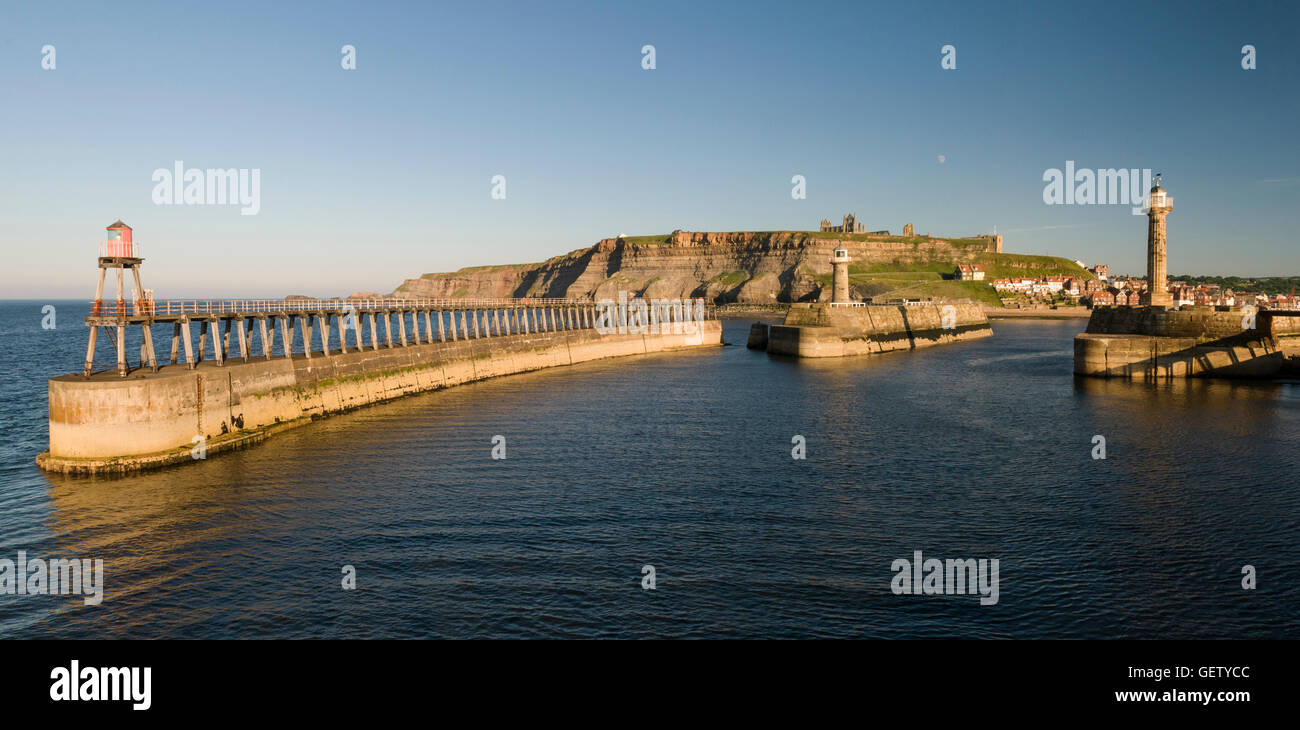 View of Whitby Pier looking back towards the town with the Abbey on the ...