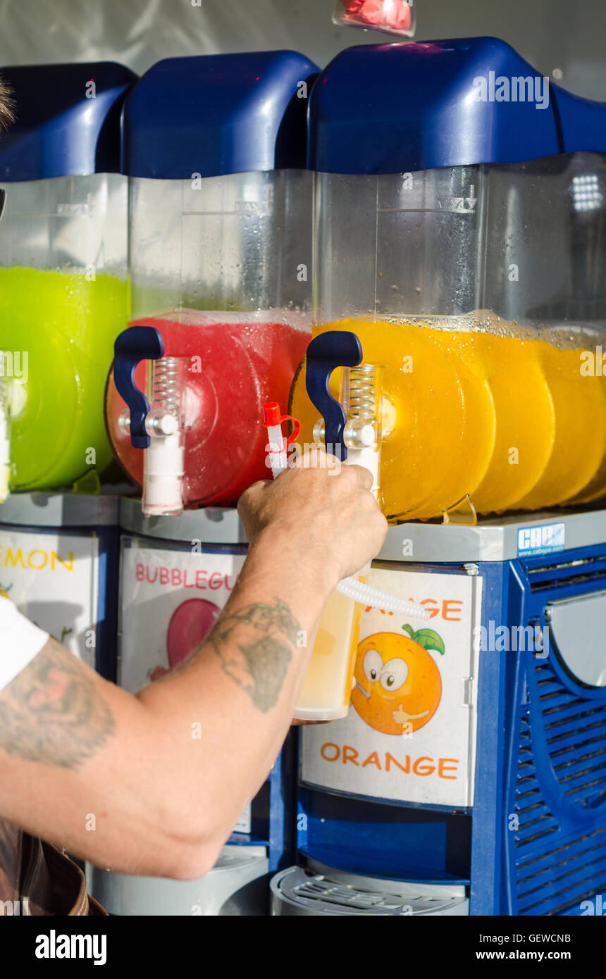 A stall selling slushies.. a partly frozen fruit flavoured drink Stock ...
