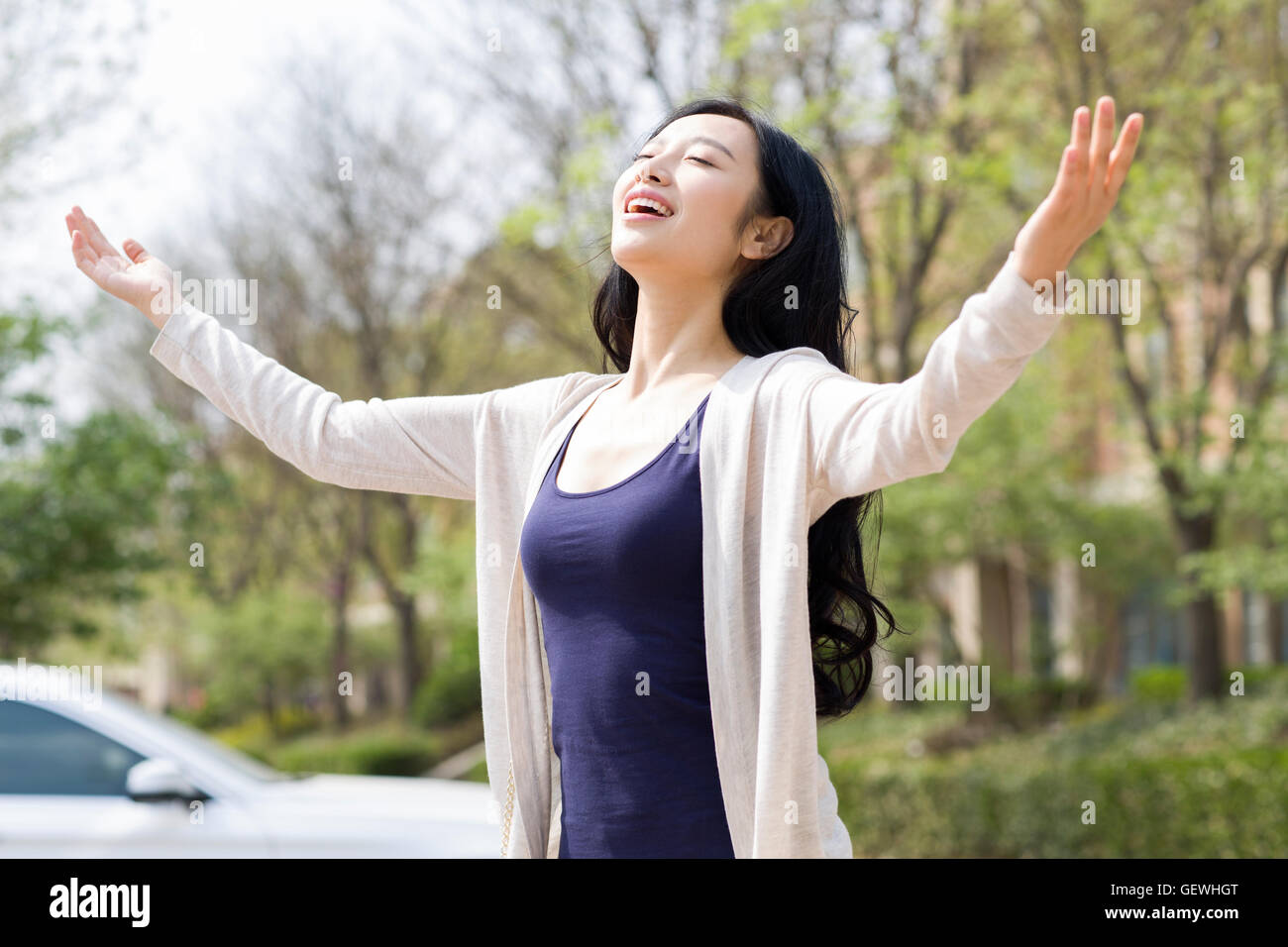 Happy young Chinese woman Stock Photo - Alamy