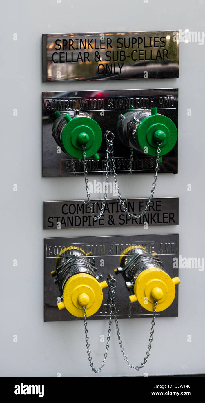 Detail of chrome fire department connection on building Stock Photo - Alamy