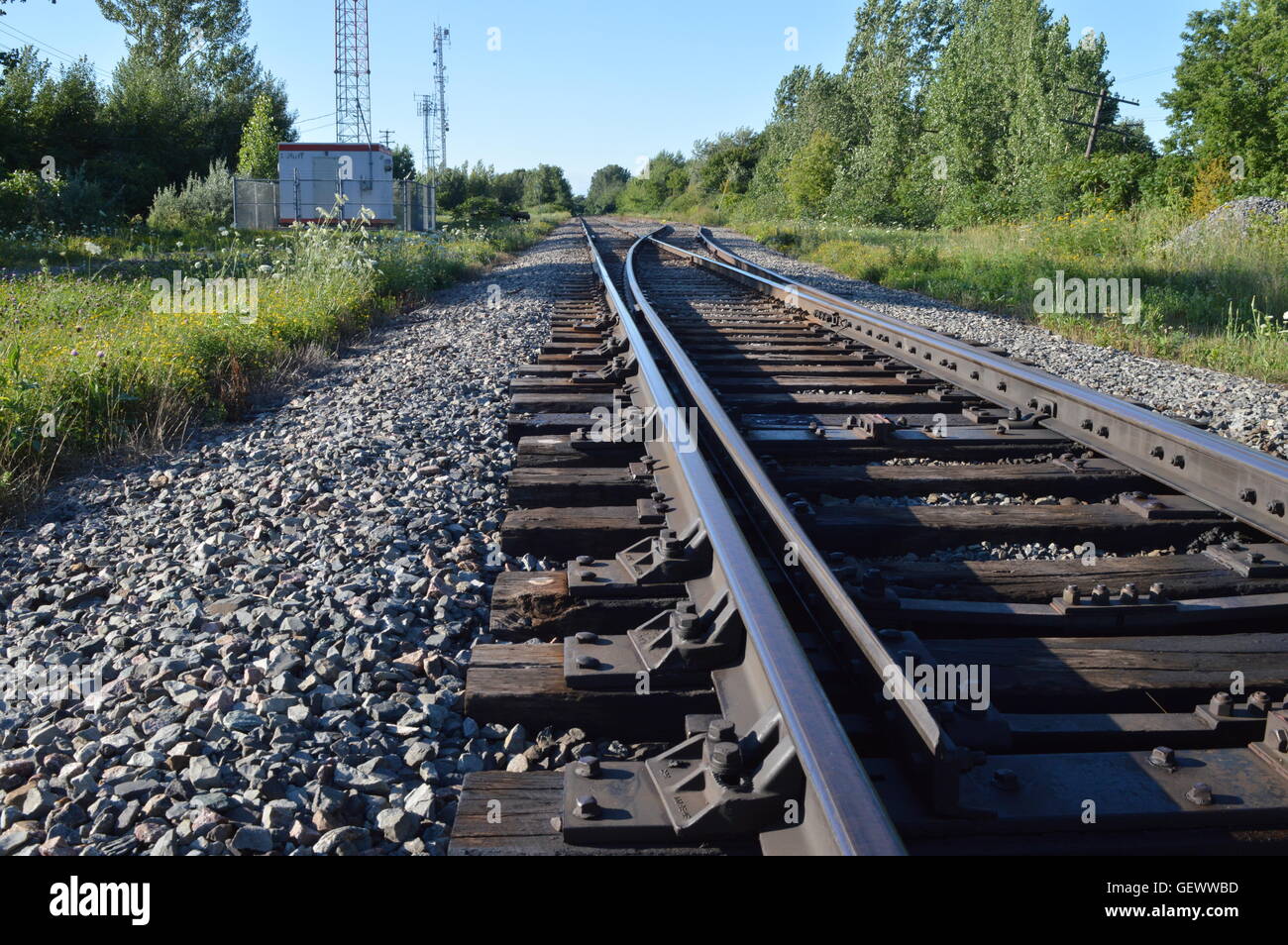 Sunny day on the train rails Stock Photo - Alamy