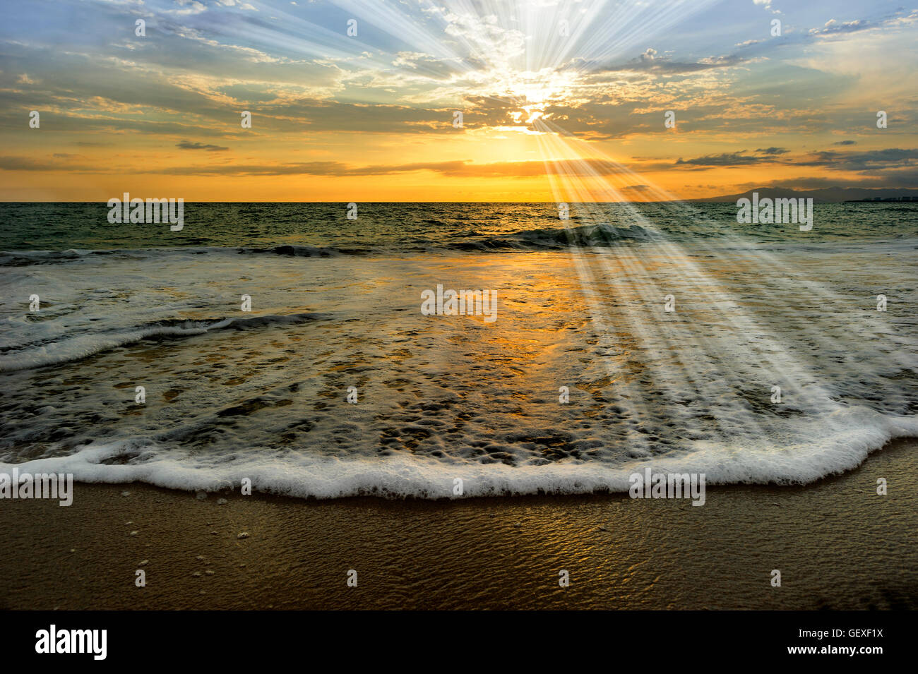 Ocean sunset rays is an ethereal ocean scenic with sun beams bursting ...