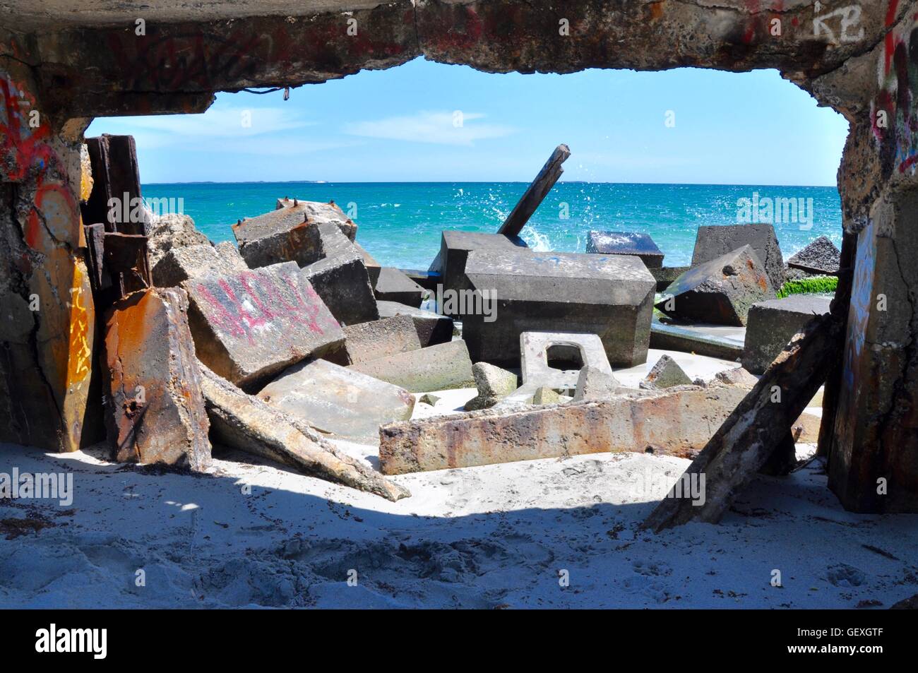 View through concrete, tagged breakwater with ecology blocks of the ...