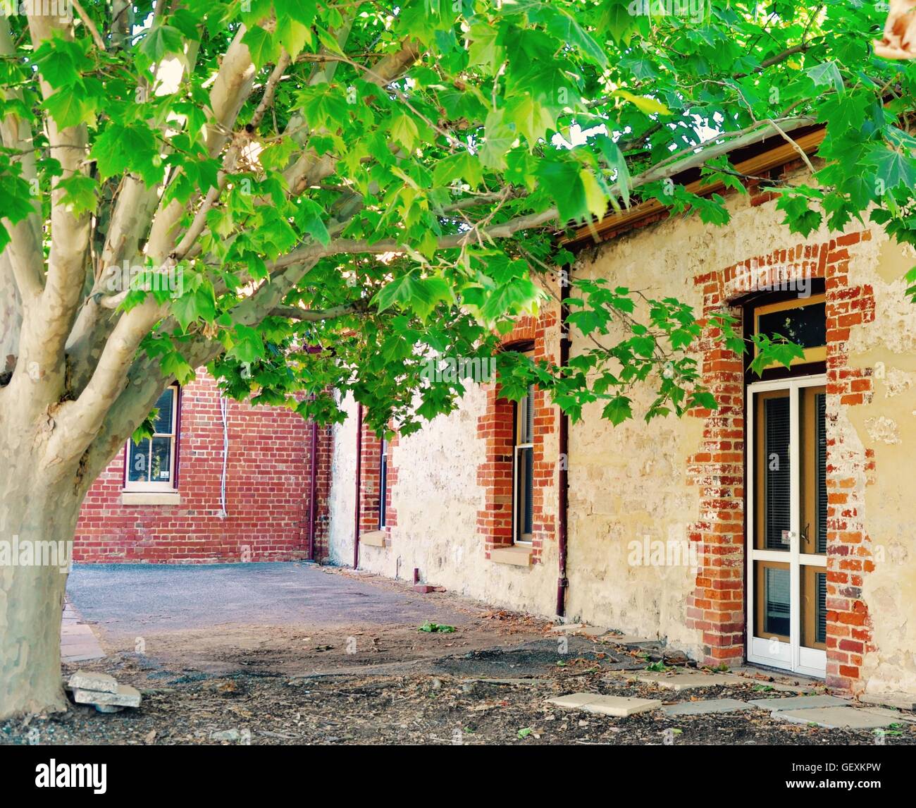 Courtyard with old limestone brick and red brick architecture with ...