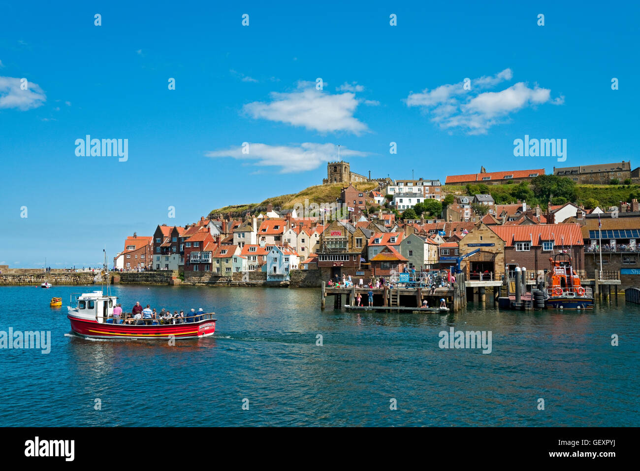 Fishing boat leaving Whitby harbour Stock Photo - Alamy