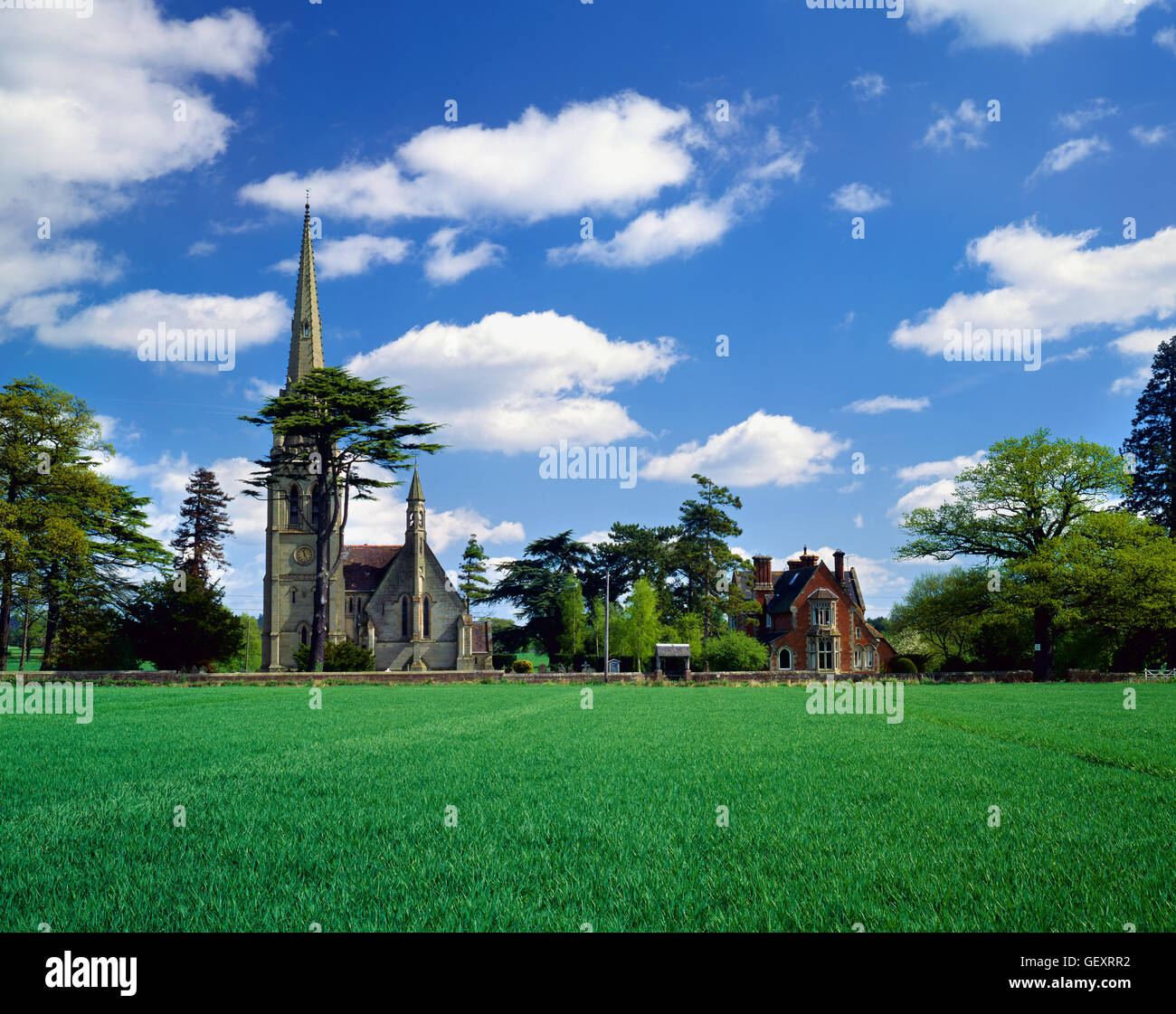 A view across farmland of Holy Trinity Church in Leaton Stock Photo - Alamy