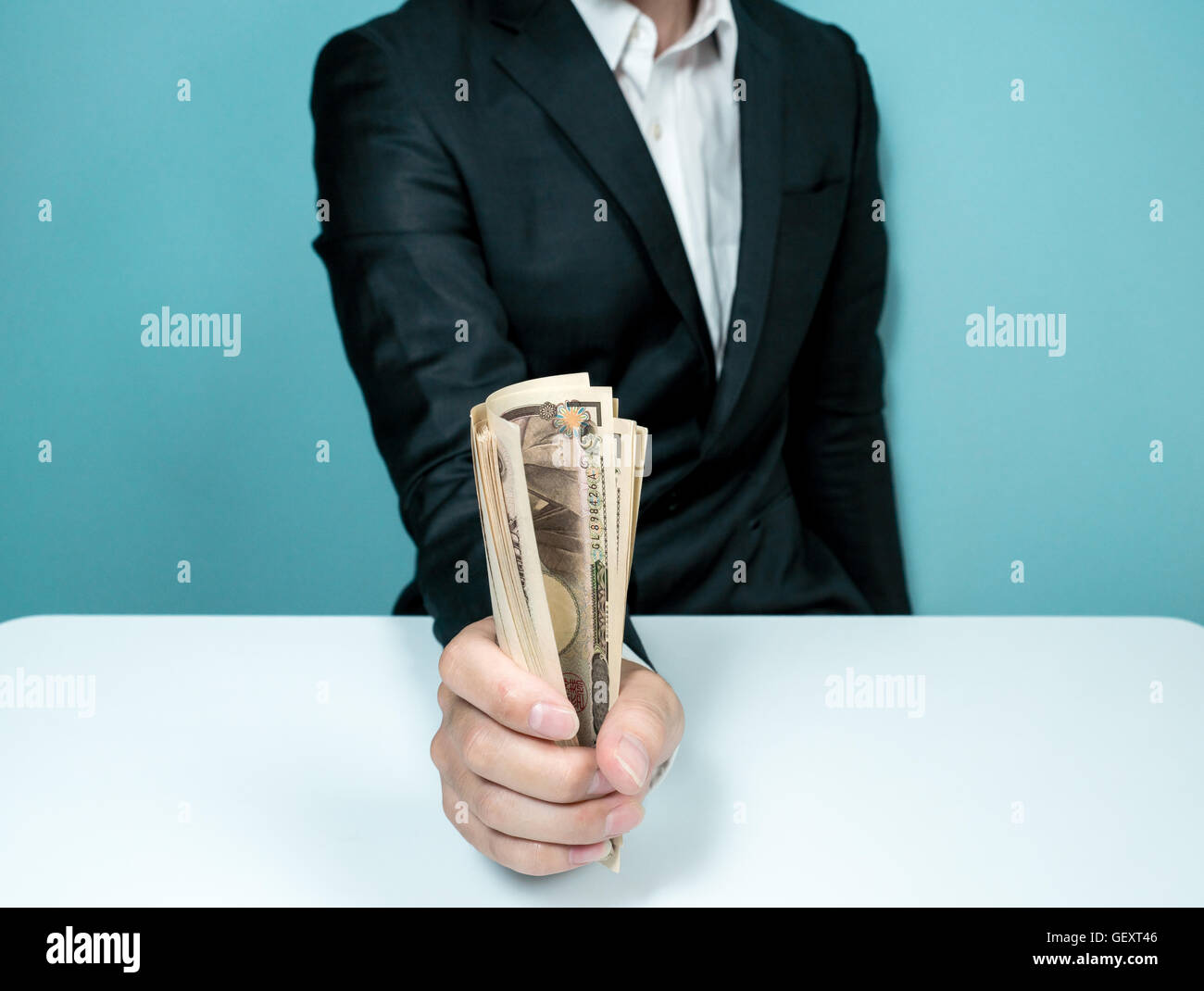 Businessman holding a lot of ten thousands yen Stock Photo - Alamy
