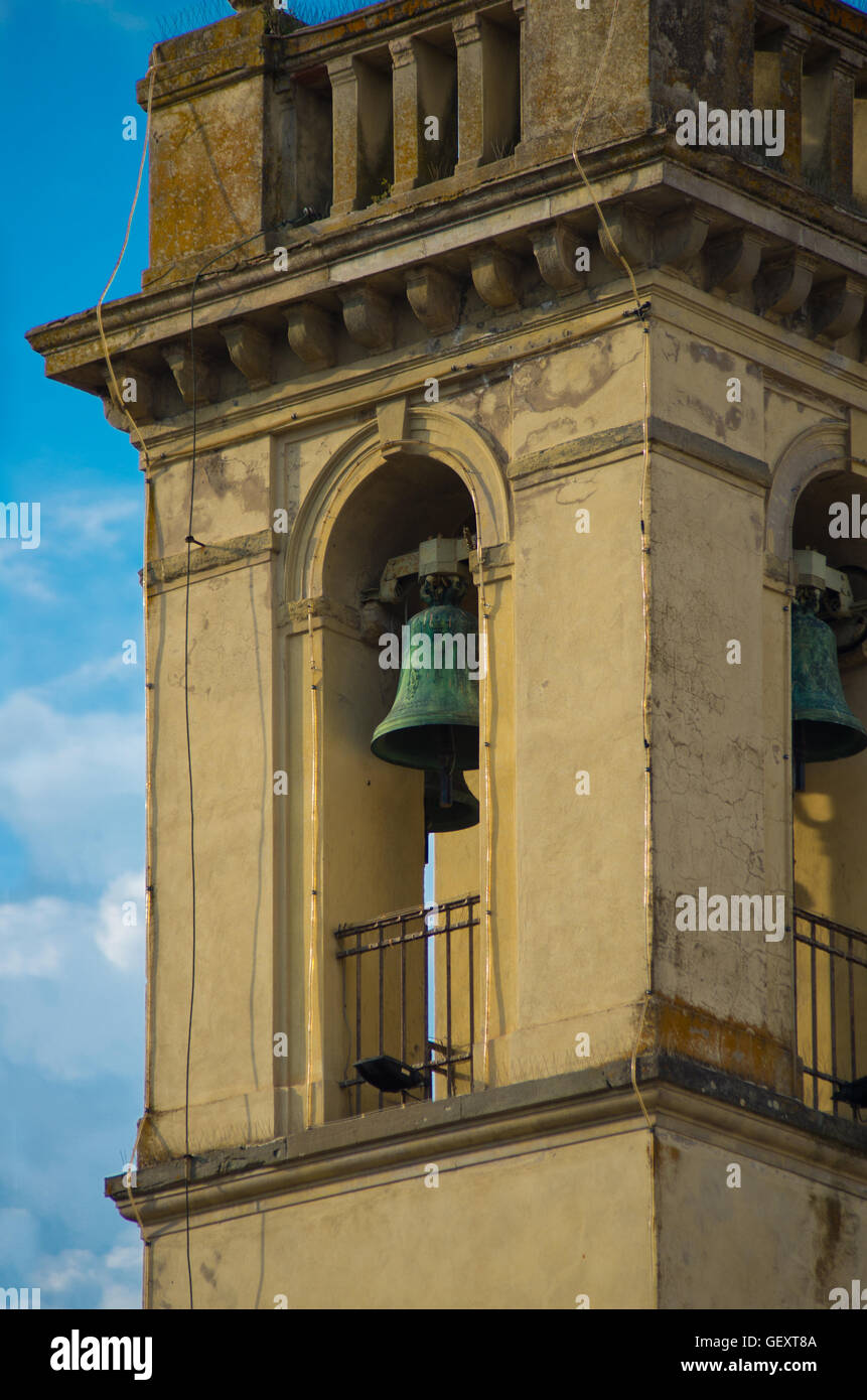 ancient bell tower made of masonry plastered with bronze bells, merlons ...