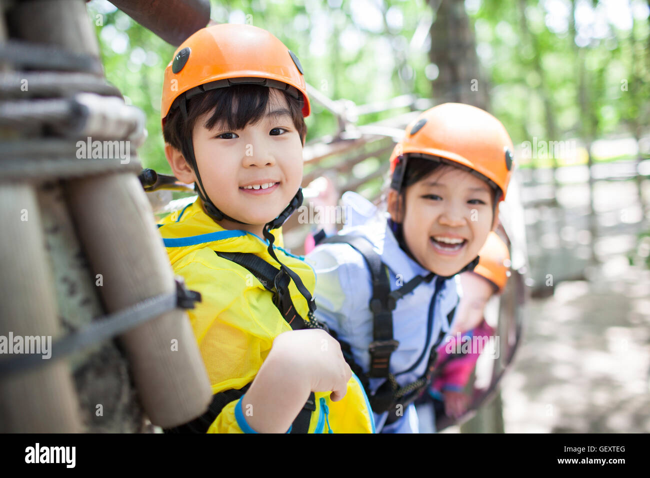 Children crossing rope bridge hi-res stock photography and images - Alamy