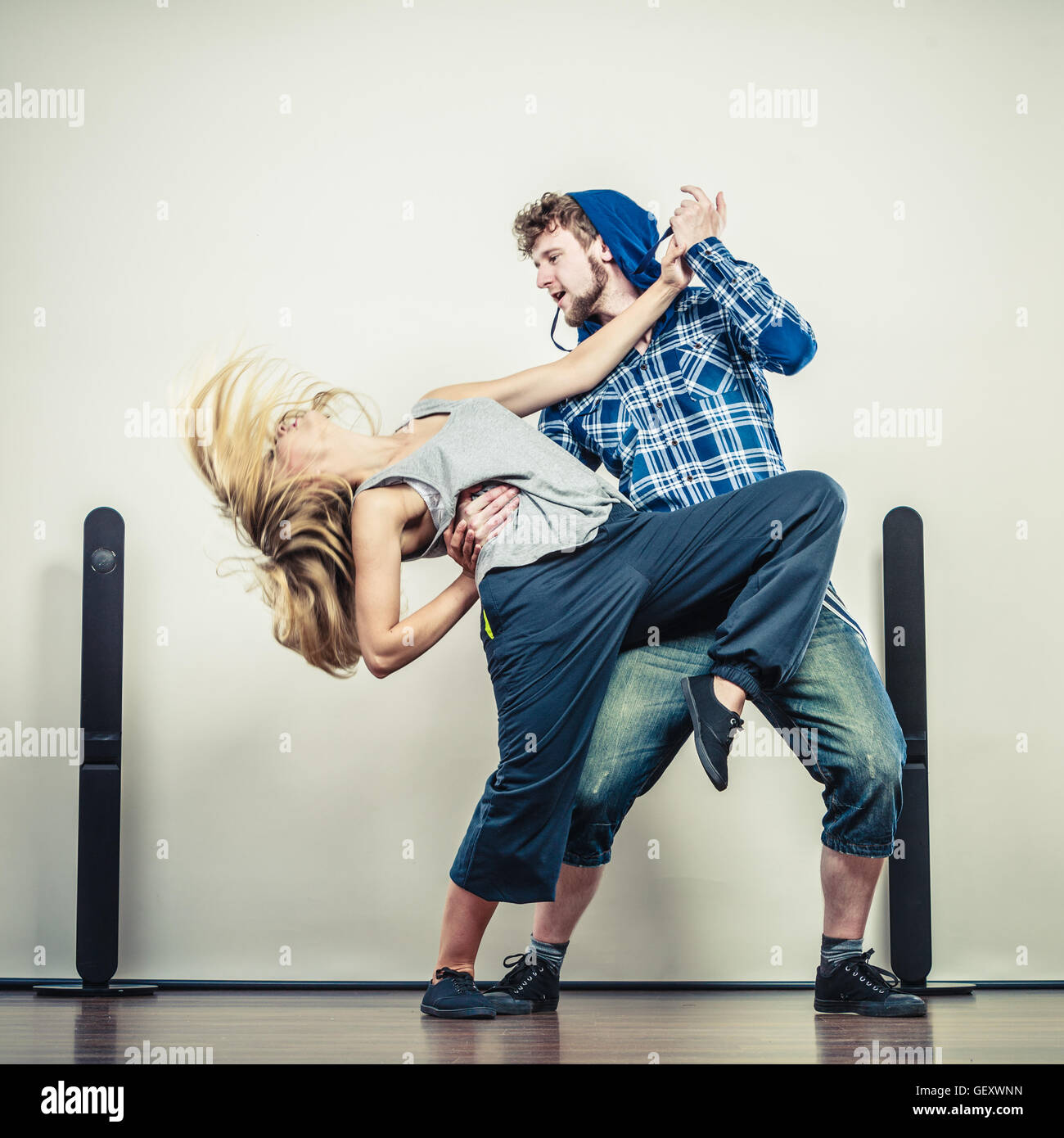 Two modern dancers couple woman and man dancing. Urban lifestyle. Hip ...