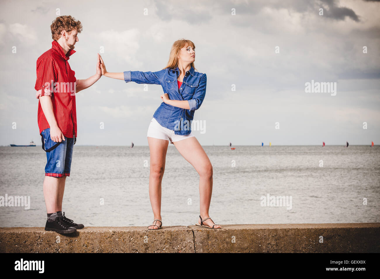 Unhappy upset angry woman refuses apology. Boyfriend trying to convince ...