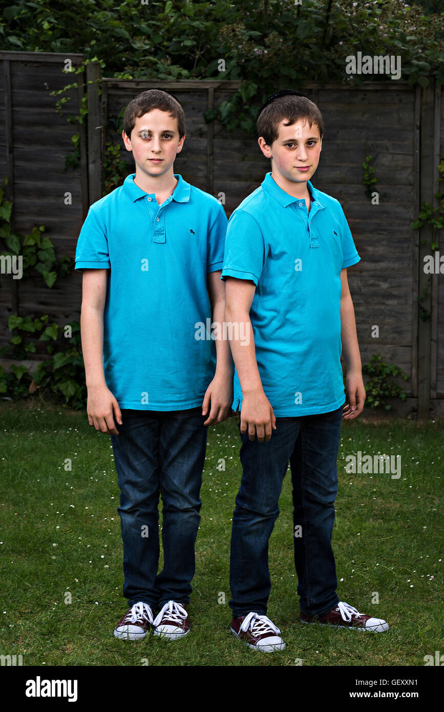 Young twin brothers in their back garden Stock Photo - Alamy
