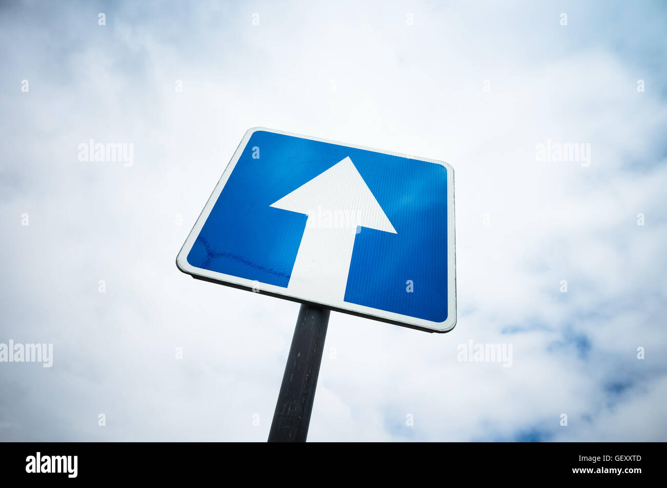 One way street, square blue road sign over cloudy sky background Stock ...