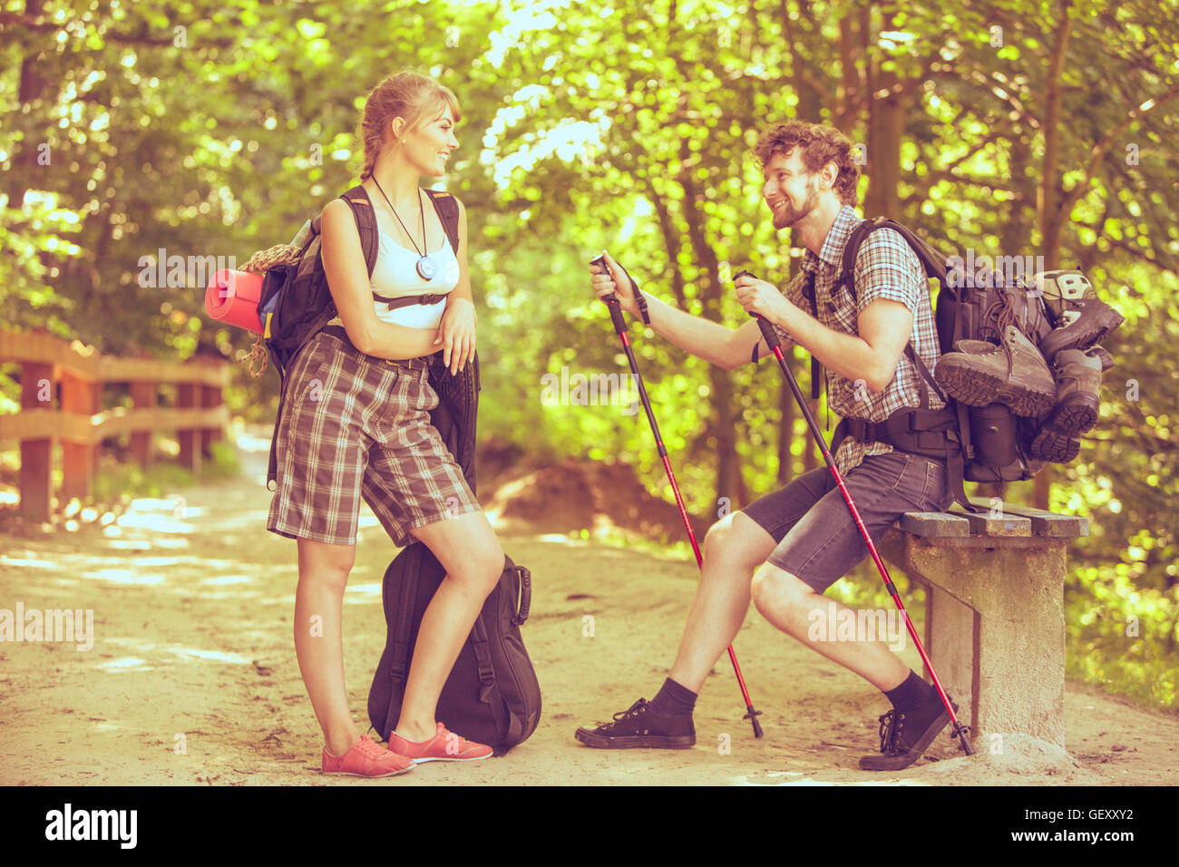 Adventure, tourism, enjoying summer time together - Hiking young couple ...