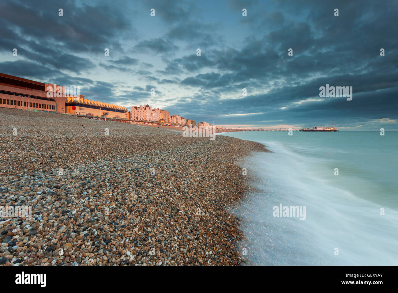 Sunset on Brighton beach Stock Photo - Alamy
