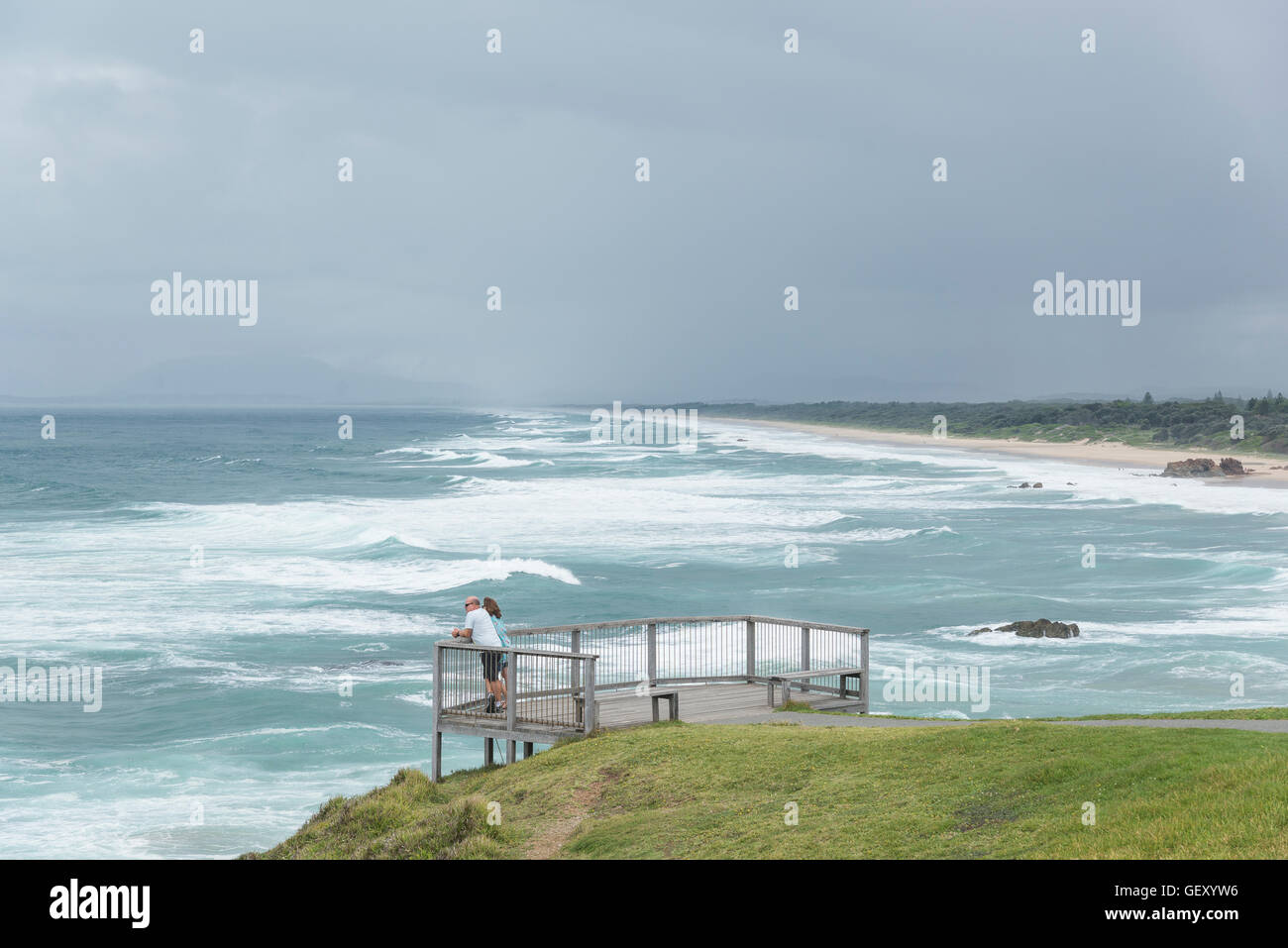 A couple looking out towards the sea Stock Photo - Alamy