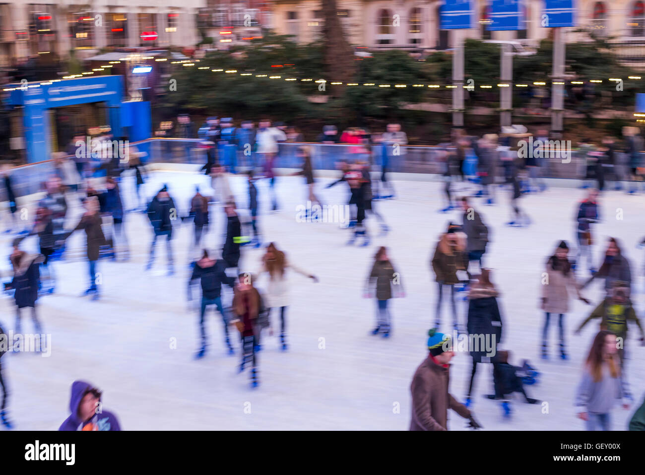 Skaters on ice rink Stock Photo - Alamy