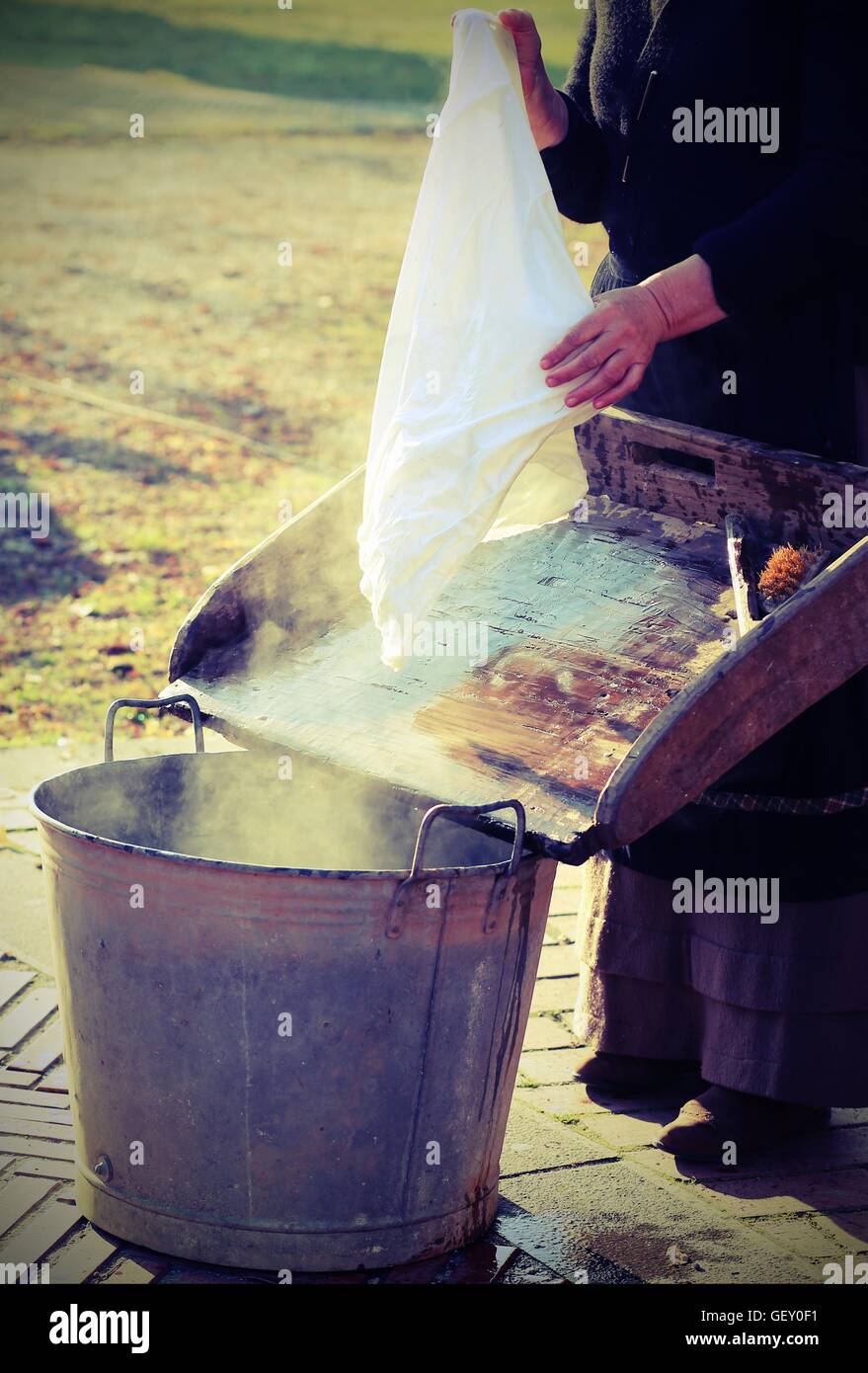 elderly during washing of the sheet on a wooden board Stock Photo - Alamy