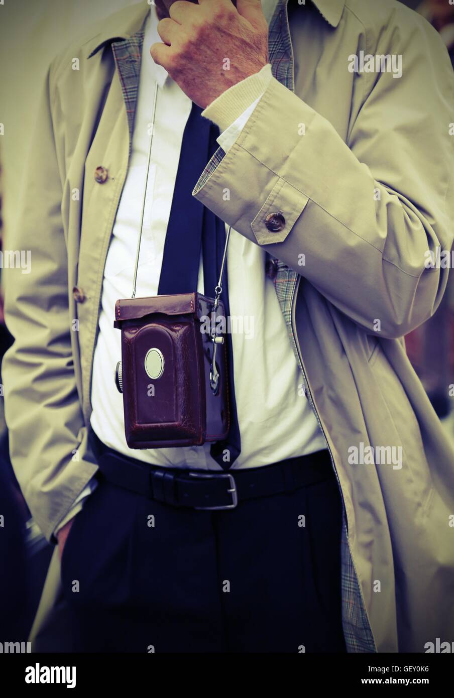 old photojournalist with antique camera and vintage clothes Stock Photo ...