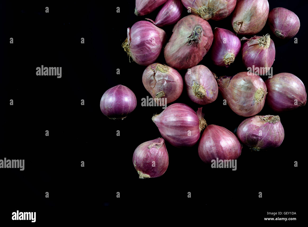 Shallots with Black Background Stock Photo - Alamy