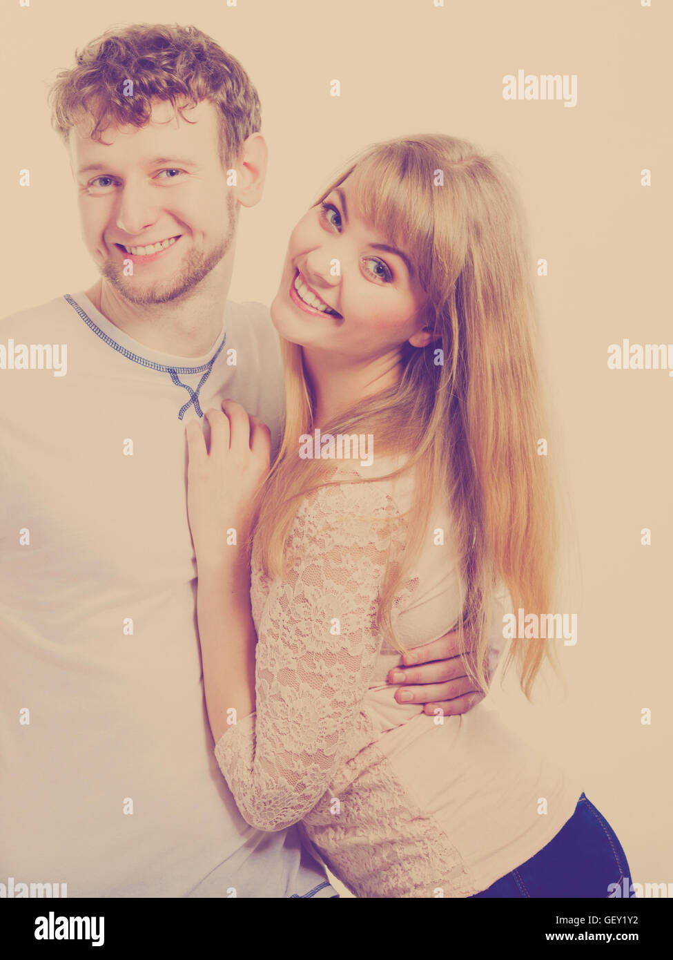 Love is everywhere. Enamoured cheerful couple in hug. Cuddling lovers ...