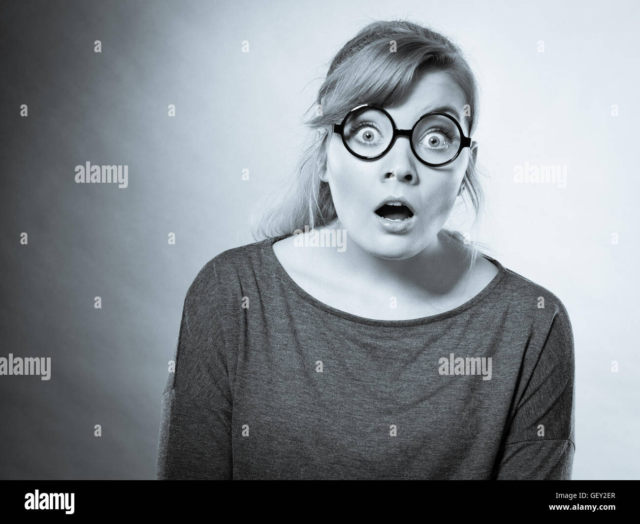 Shock and disbelief concept. Surprised astonished girl with wide open ...