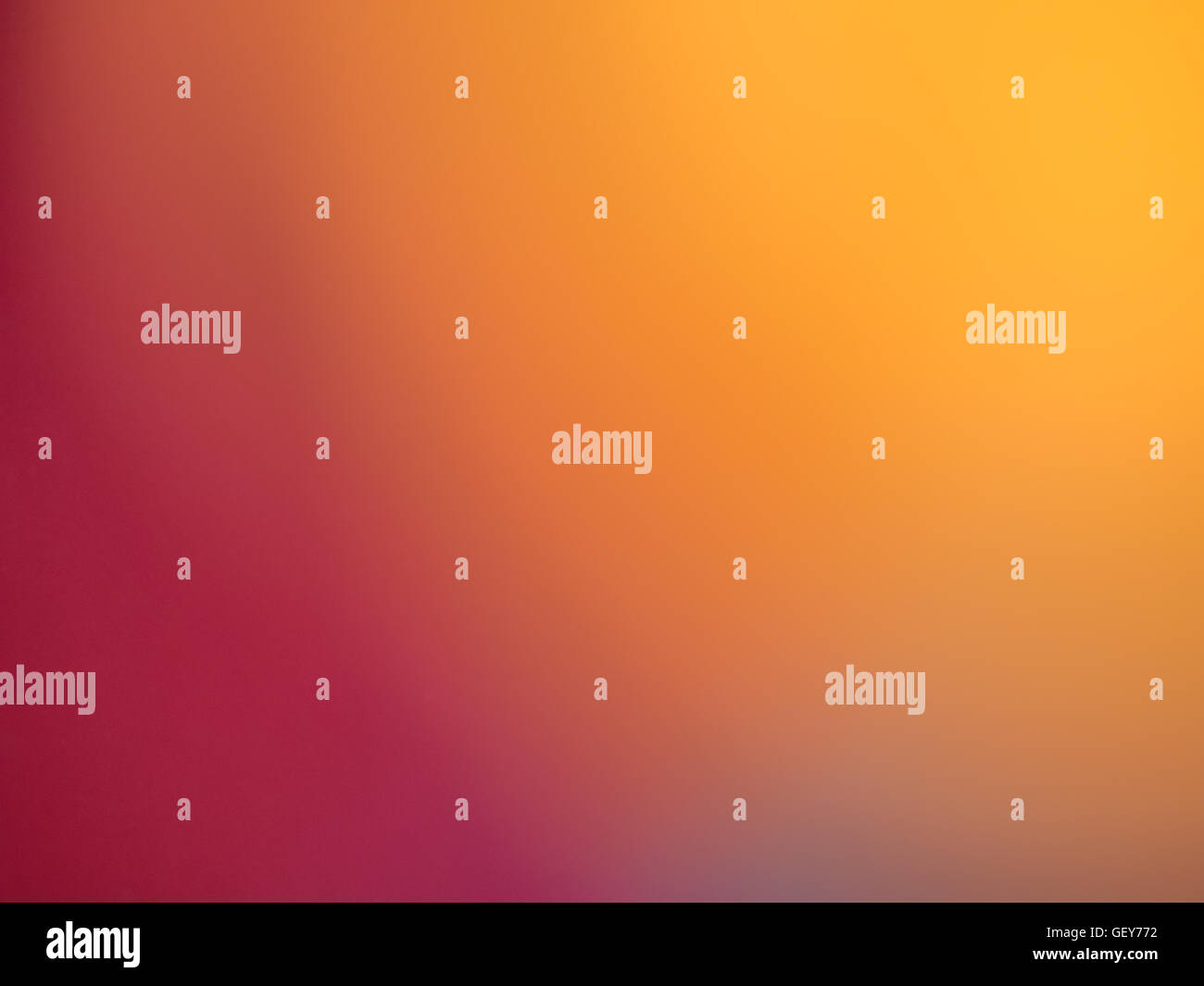 Defocused autumn sunset red orange purple and yellow colors background ...