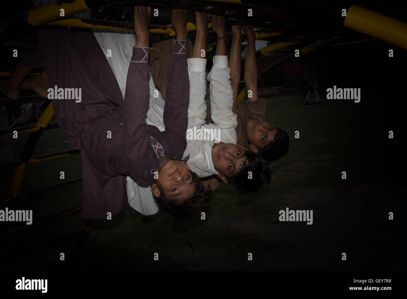 kids hanging upside down Stock Photo - Alamy