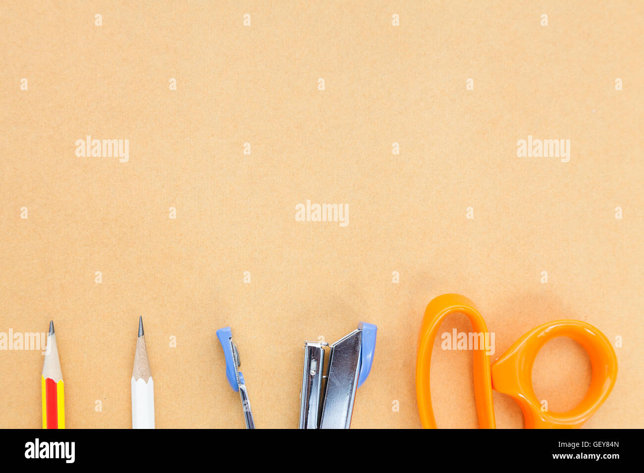 office tools placed on brown paper background in top view, Leave a ...