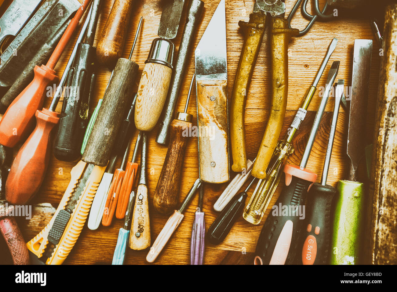 Different tools on a wooden background with retro filter effect Stock ...