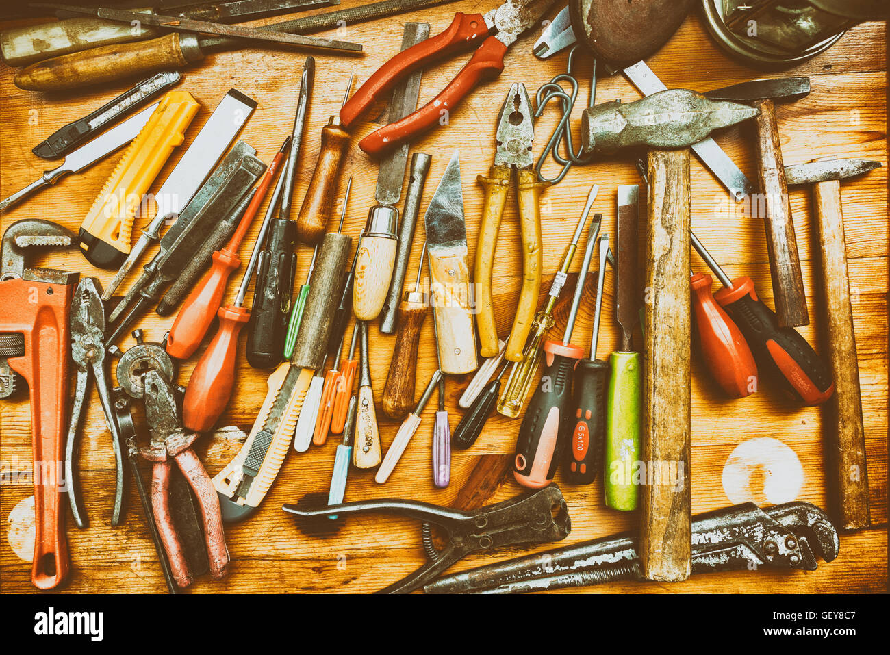 Different tools on a wooden background with retro filter effect Stock ...