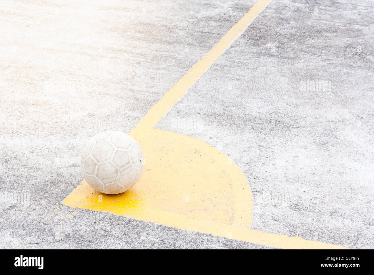 it's a ball of soccer or football place on yellow corner, ground is ...