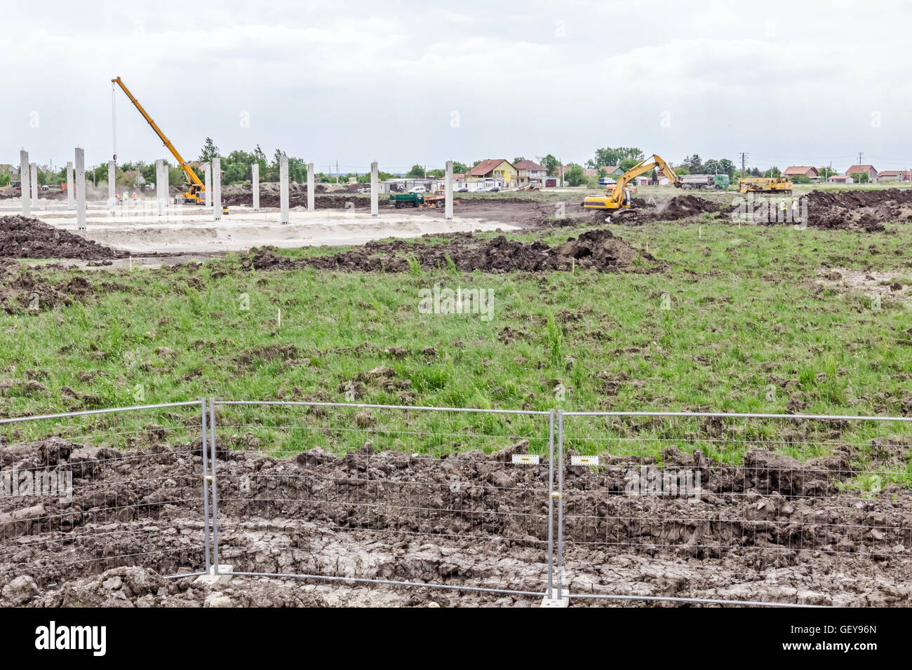Landscape transform into urban area with machinery, people are working ...