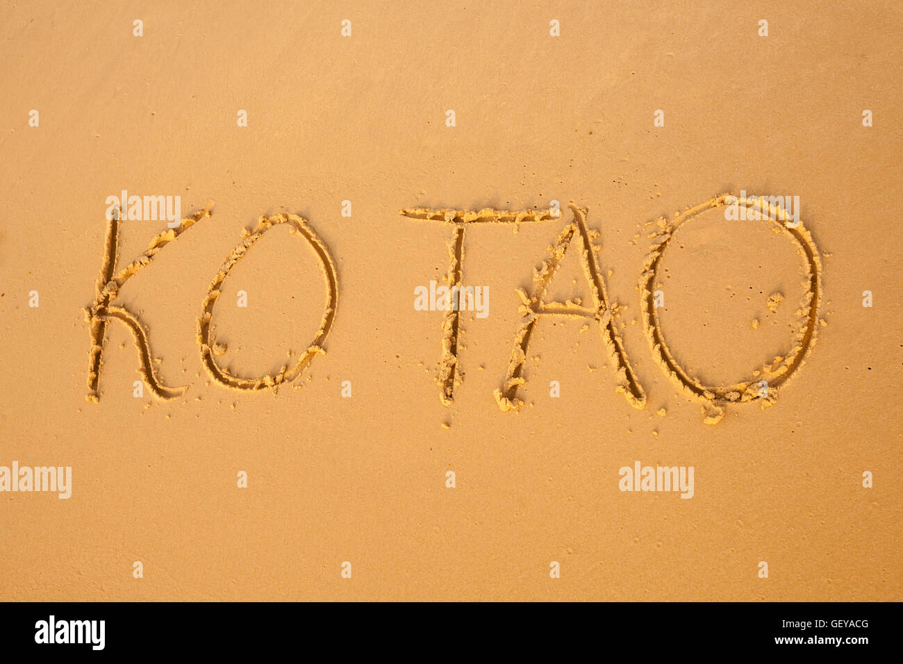 Word Ko Tao signed on beach. South east Asia symbols Stock Photo - Alamy