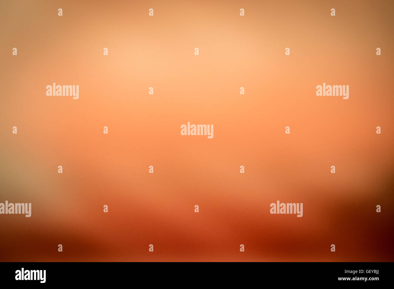 Defocused warm red and orange summer colors background Stock Photo - Alamy