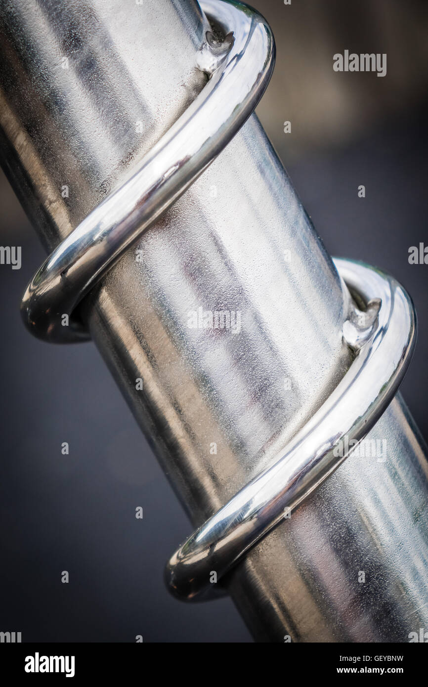 Close up of a twisting metal spiral over black background Stock Photo ...