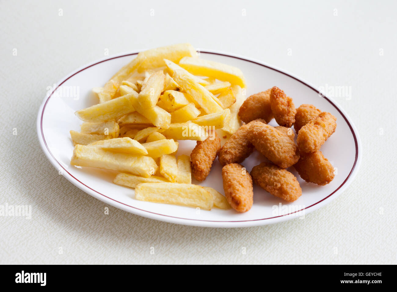 Traditional english meal - deep fried seafood, scampi with chips served ...