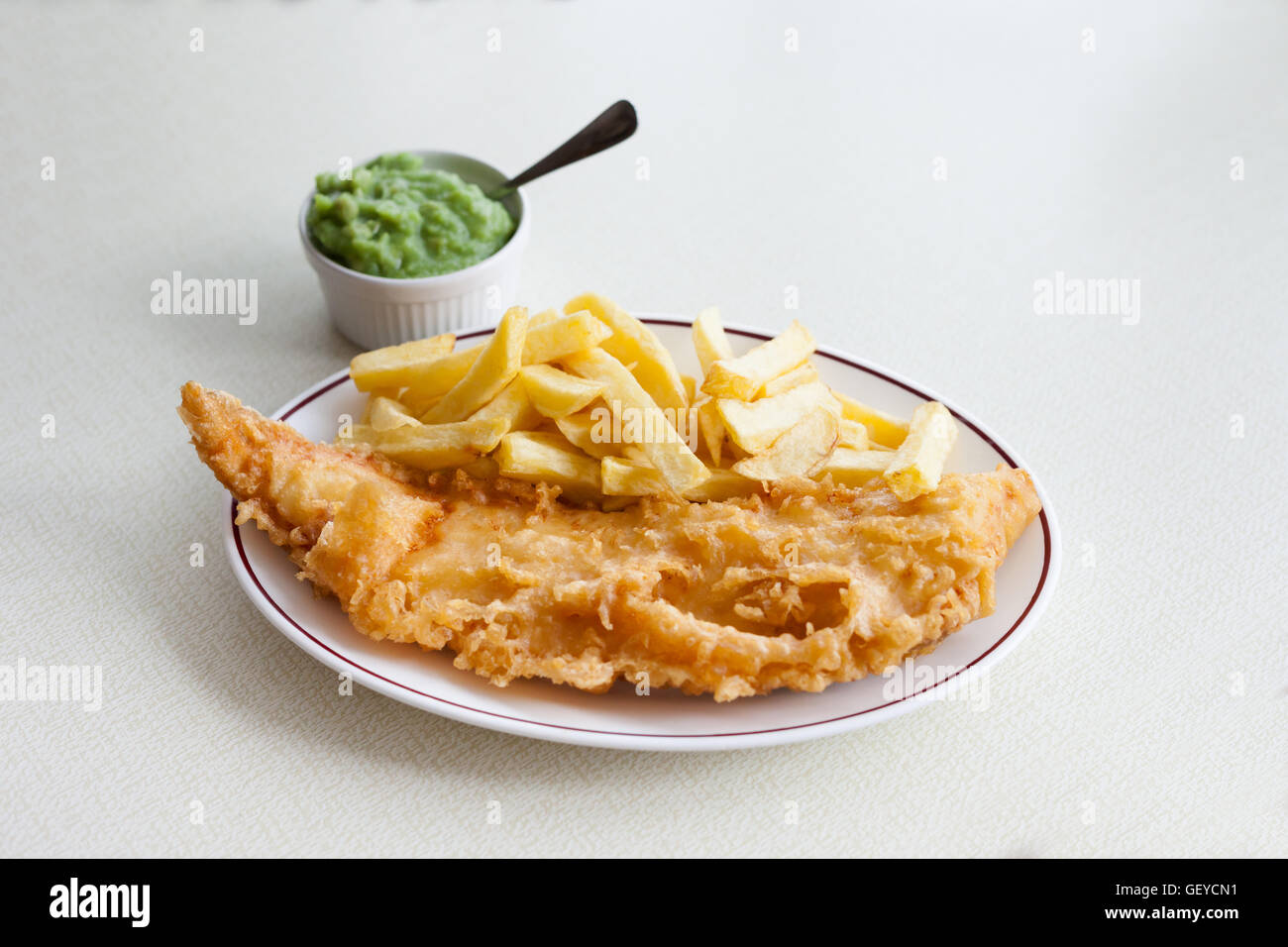 Traditional english meal - deep fried fish, cod with chips and mashed ...
